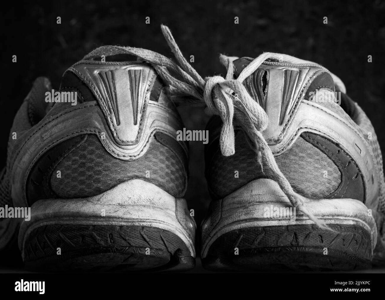 Back view of pair of old running shoes - B&W Stock Photo - Alamy