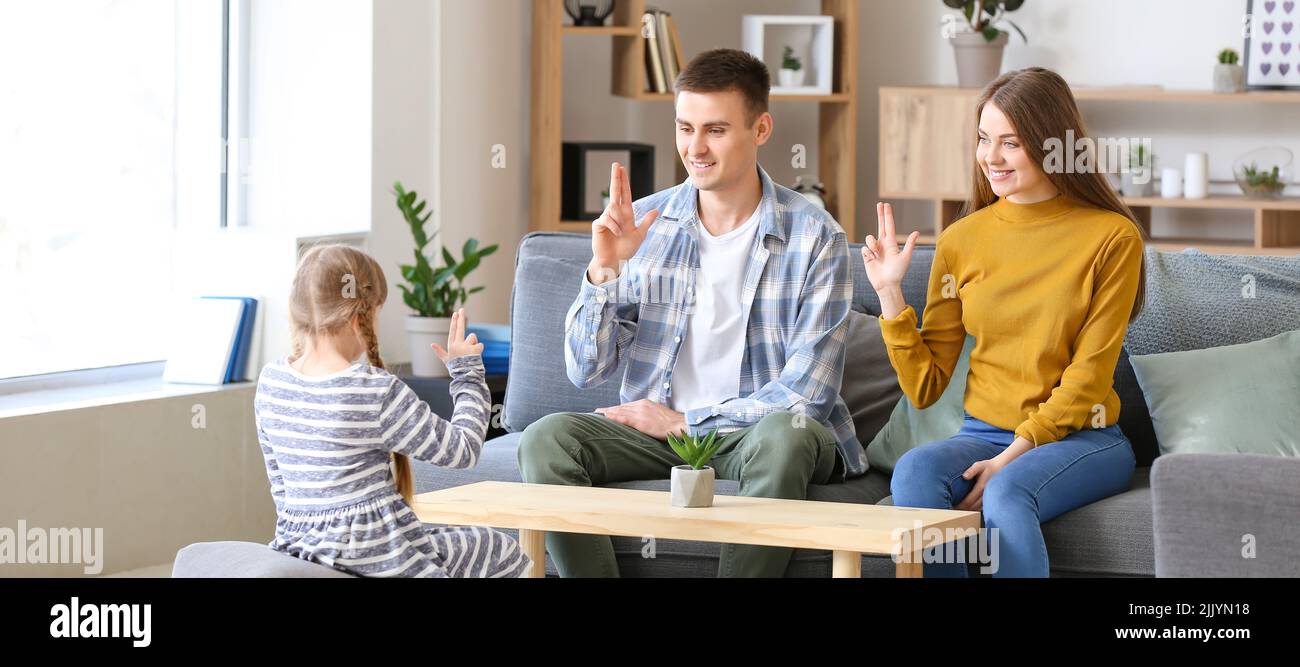 Deaf mute family using sign language at home Stock Photo - Alamy