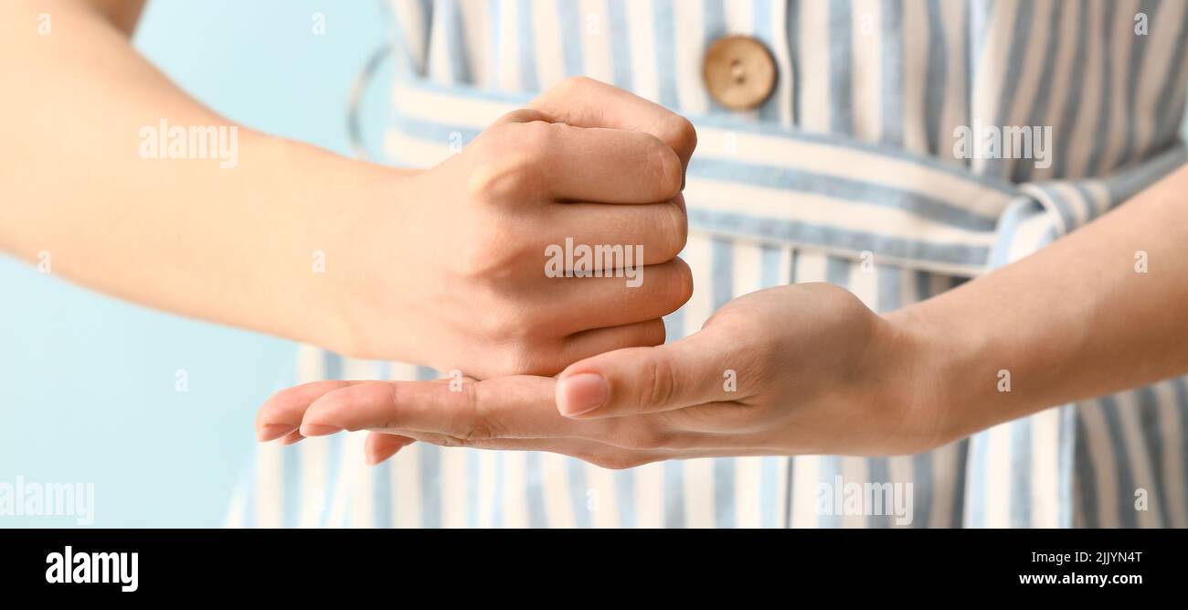 Young deaf mute woman using sign language, closeup Stock Photo - Alamy