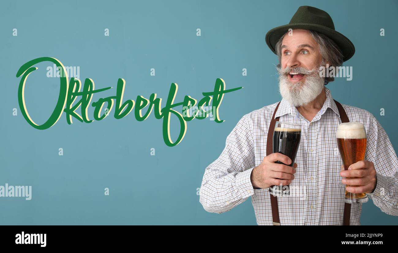 Handsome man in traditional German clothes and with beer on blue ...