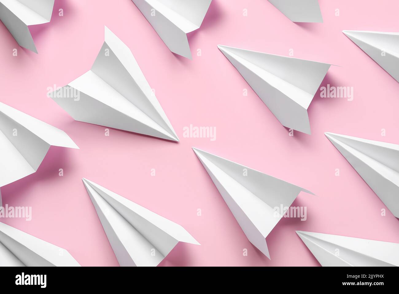 Paper planes on pink background Stock Photo - Alamy