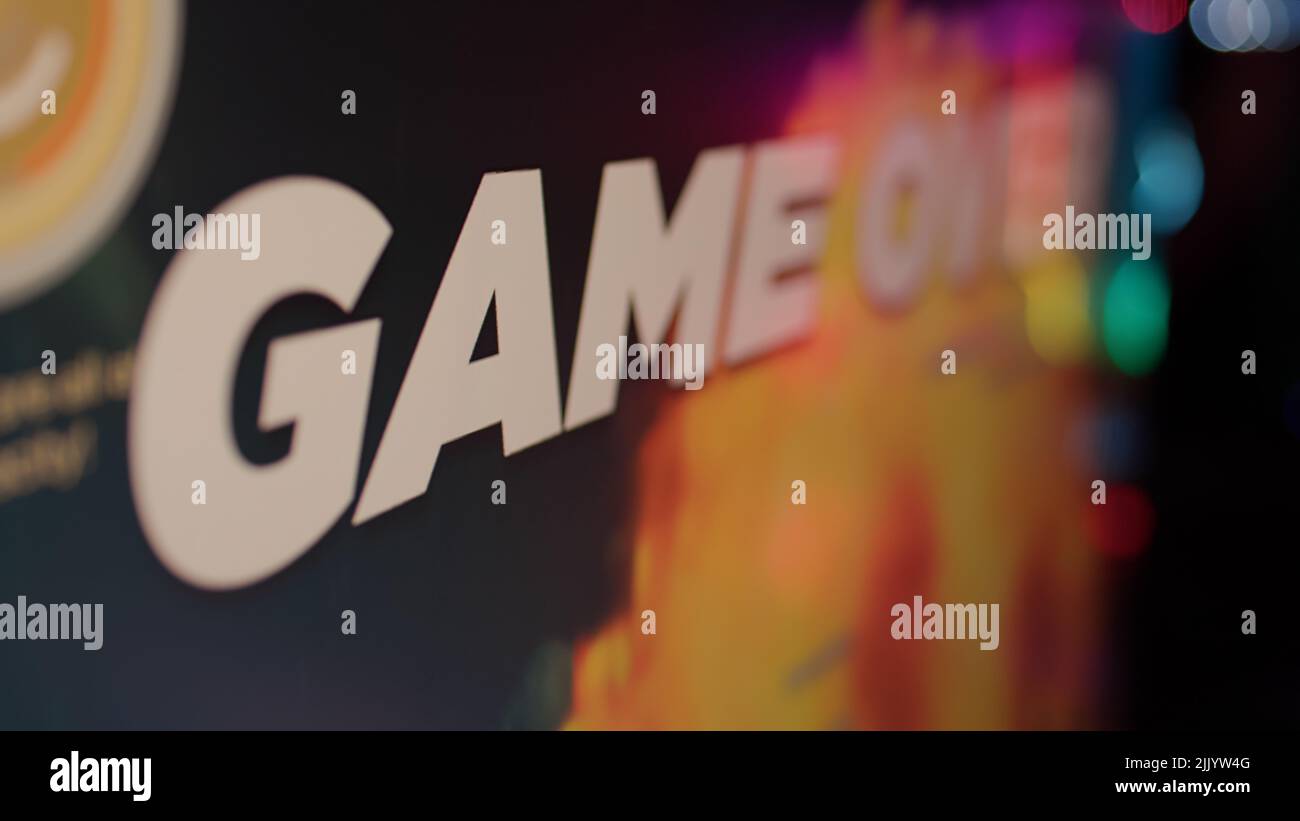 Extreme closeup on game over text on computer screen after failing ...