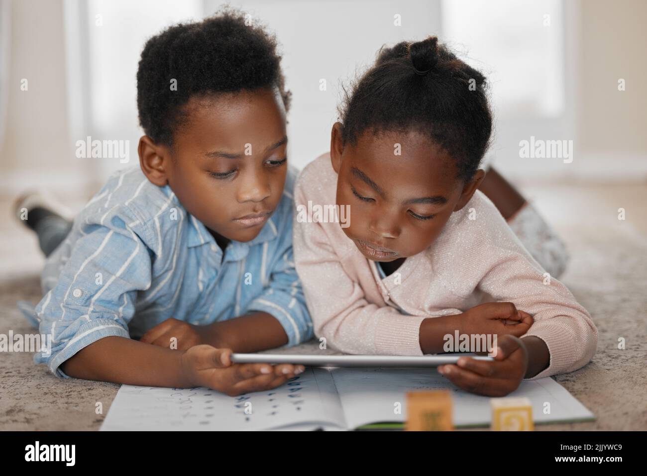 Nurturing their curious minds through educational apps. a little boy ...