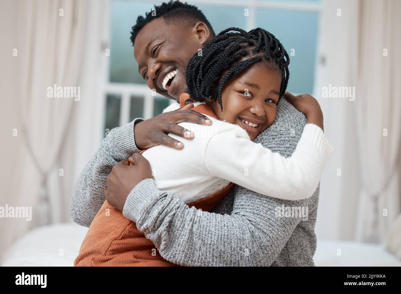 Father And Teen Daughter Hugging