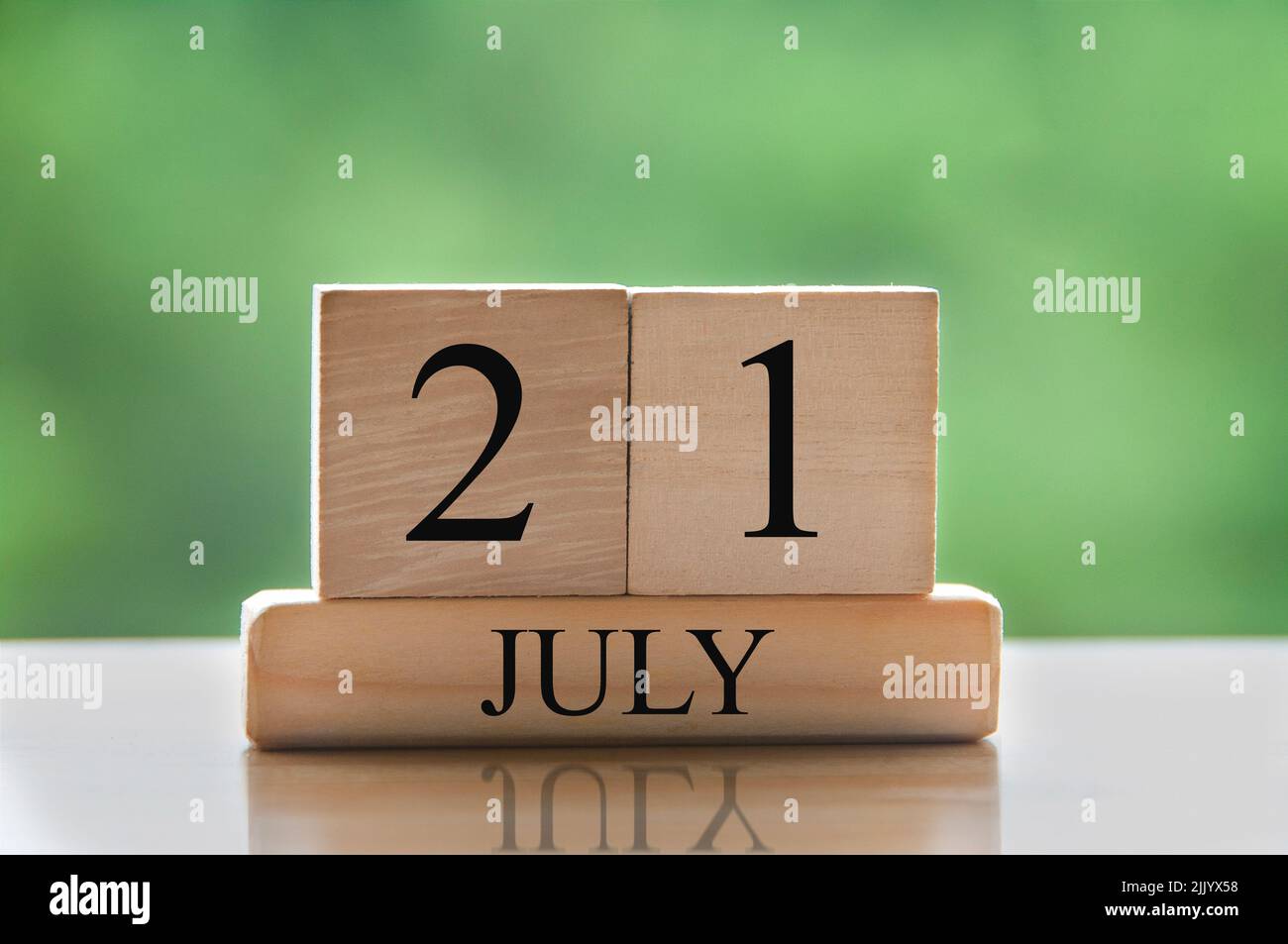 July 21 calendar date text on wooden blocks with blurred background ...