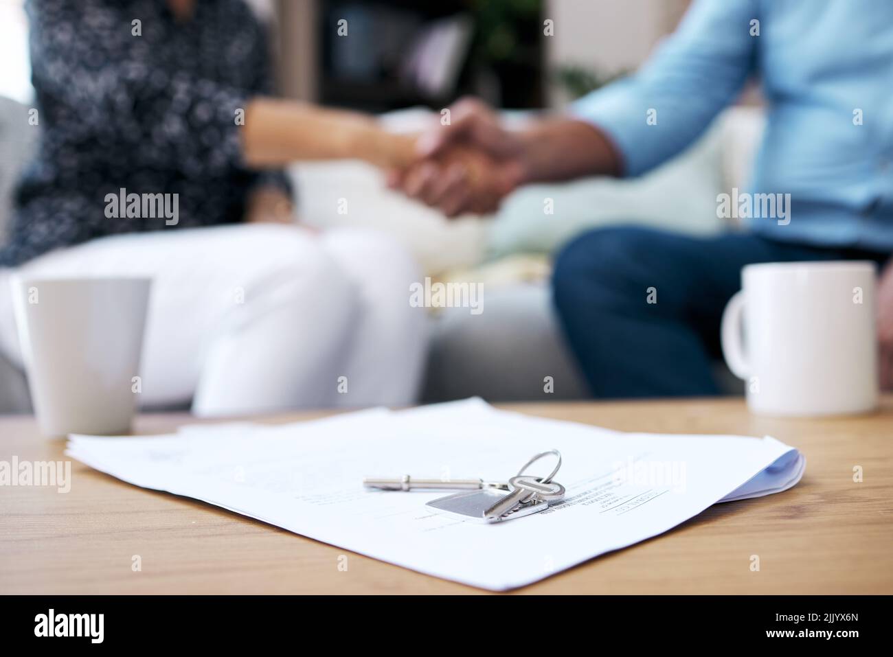 Time to shake on it. two unrecognizable people shaking hands after a ...