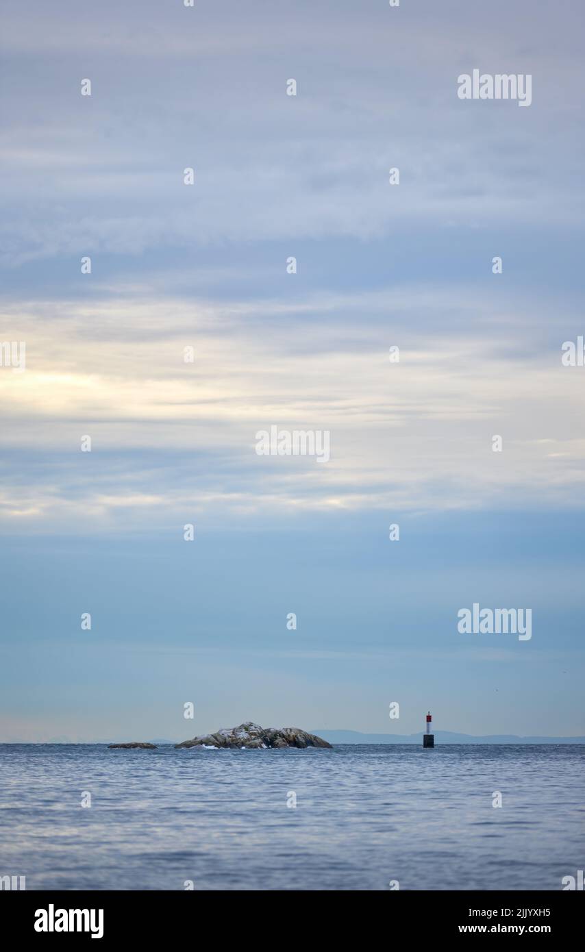 Rocky Islet and Navigation Aid. A rocky islet and marine navigation aid ...