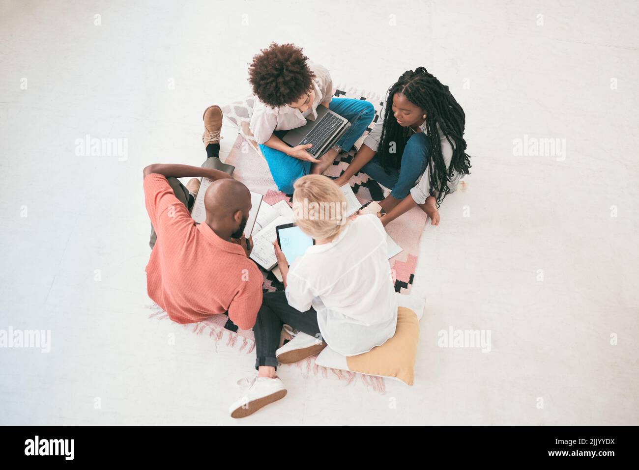 Teamwork, unity and support with diverse group students from above ...