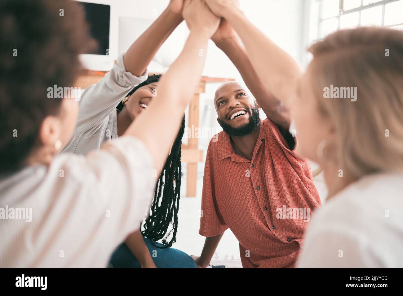 Teamwork, unity and high five from young students having fun while ...