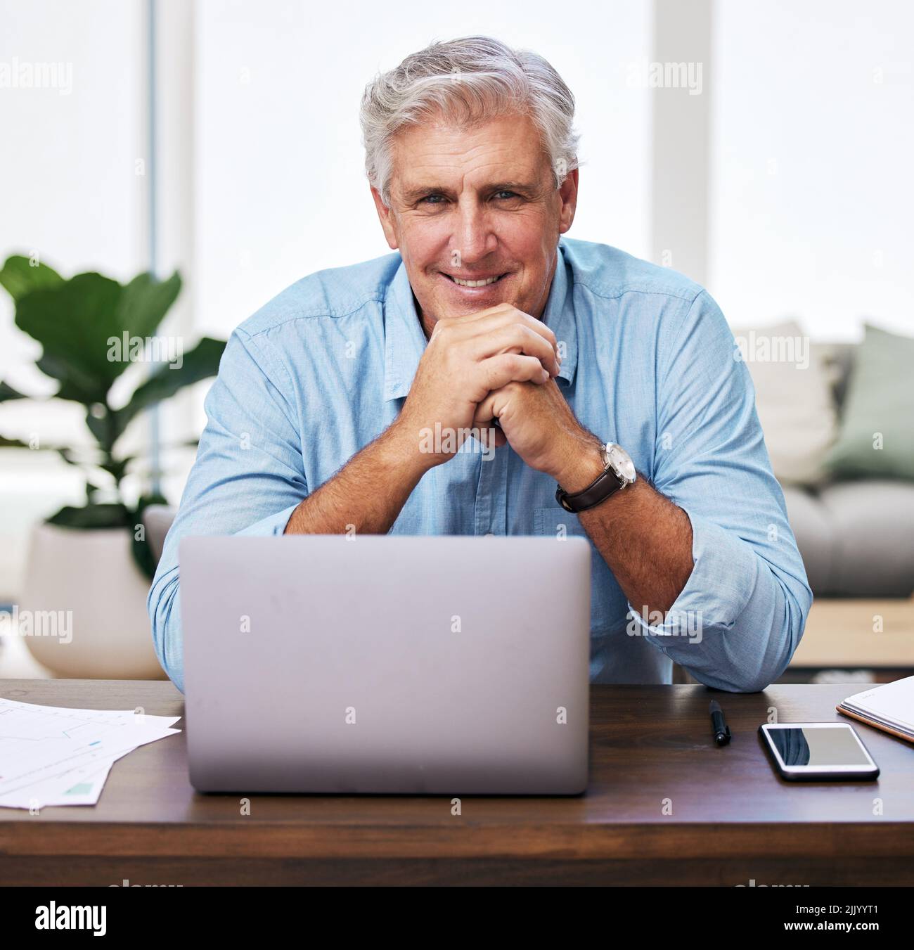 Working from home saves the the back and forth commute. a senior man ...