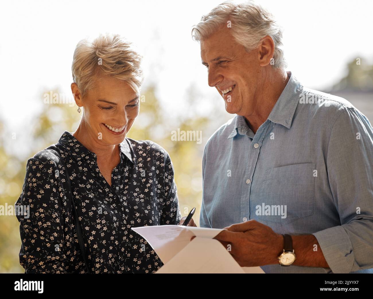 New happy beginnings start today. a senior male realtor going through ...