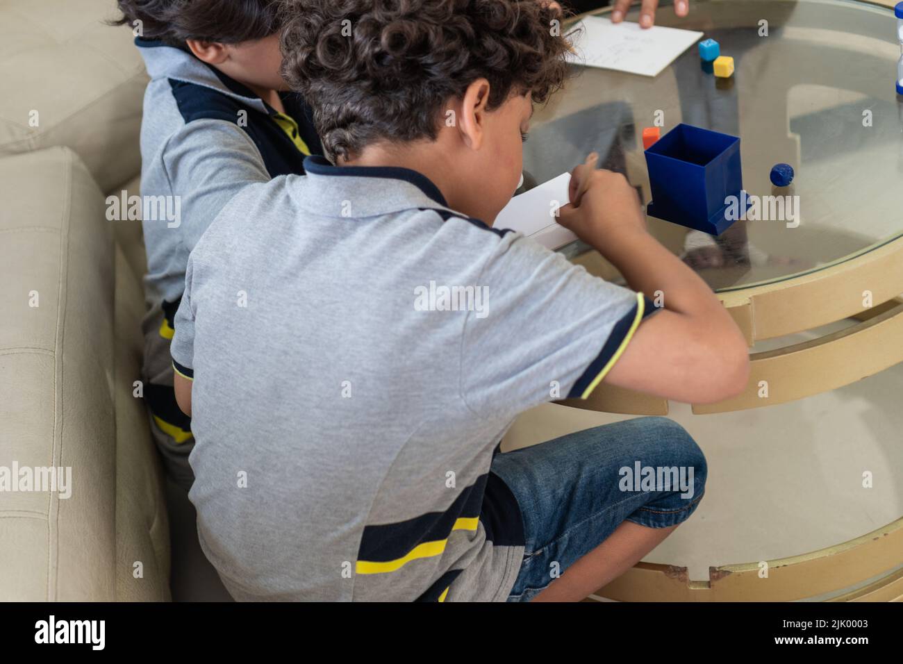 Young children drawing on paper with markers at home Stock Photo - Alamy