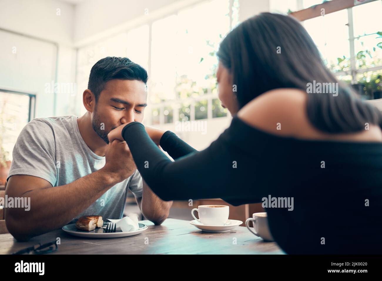 Romantic, in love and affectionate dating couple together on a date at ...