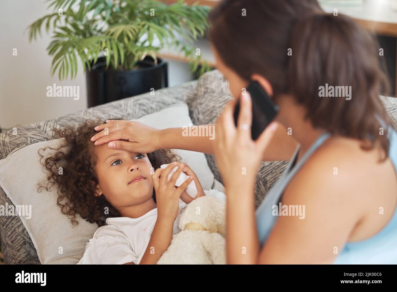 Healthcare, family and sick little child suffering from fever, flu and ...