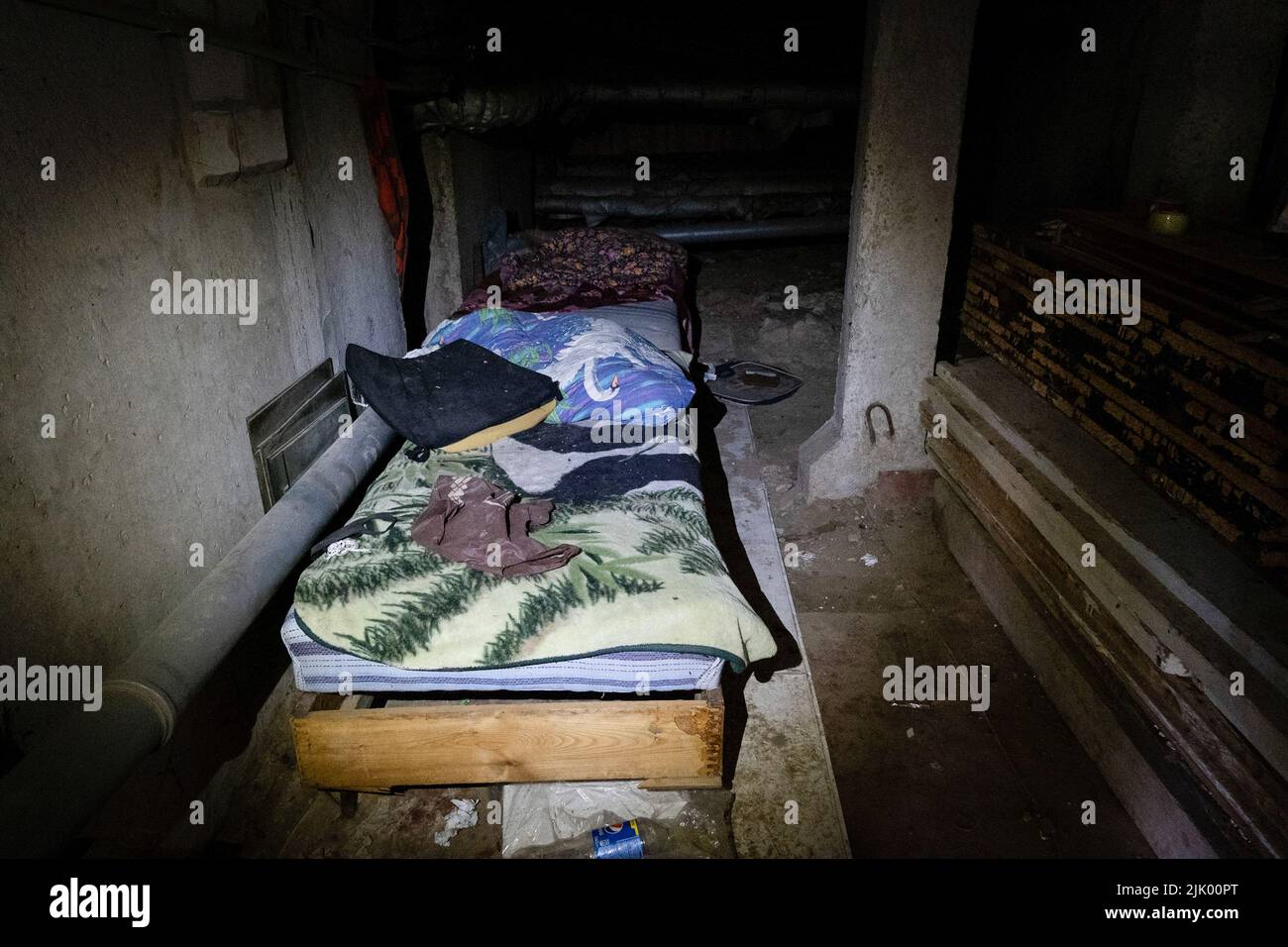 A bed of an underground basement which people used to live in to hide ...