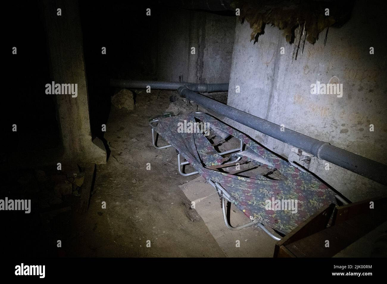 A bed of an underground basement people used to live in to hide from ...