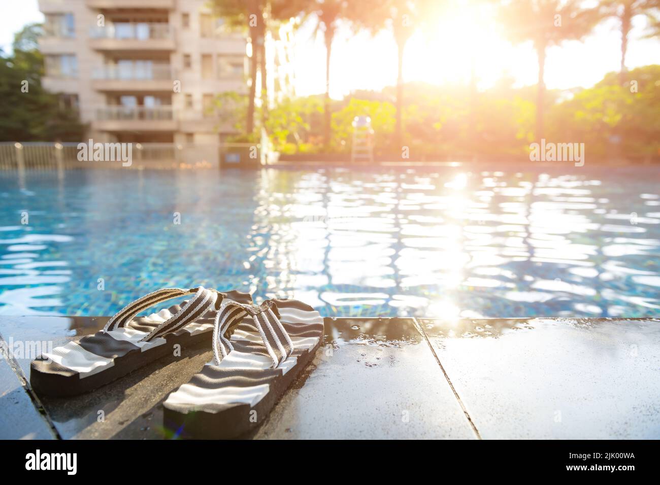swimming pool in a sunny morning with sunflare horizontal composition ...
