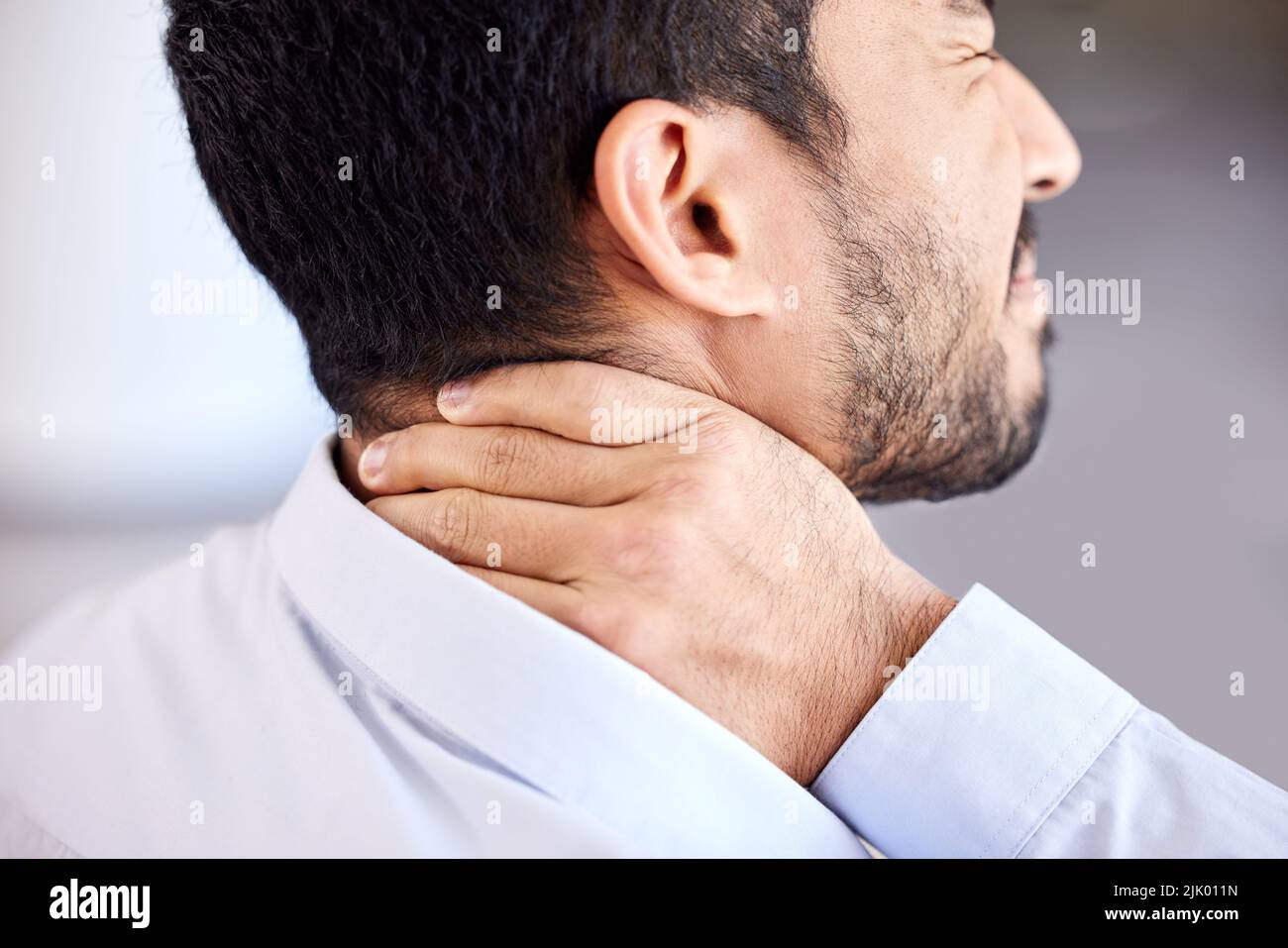 Stress, pain and sore neck closeup of businessman massaging strained ...