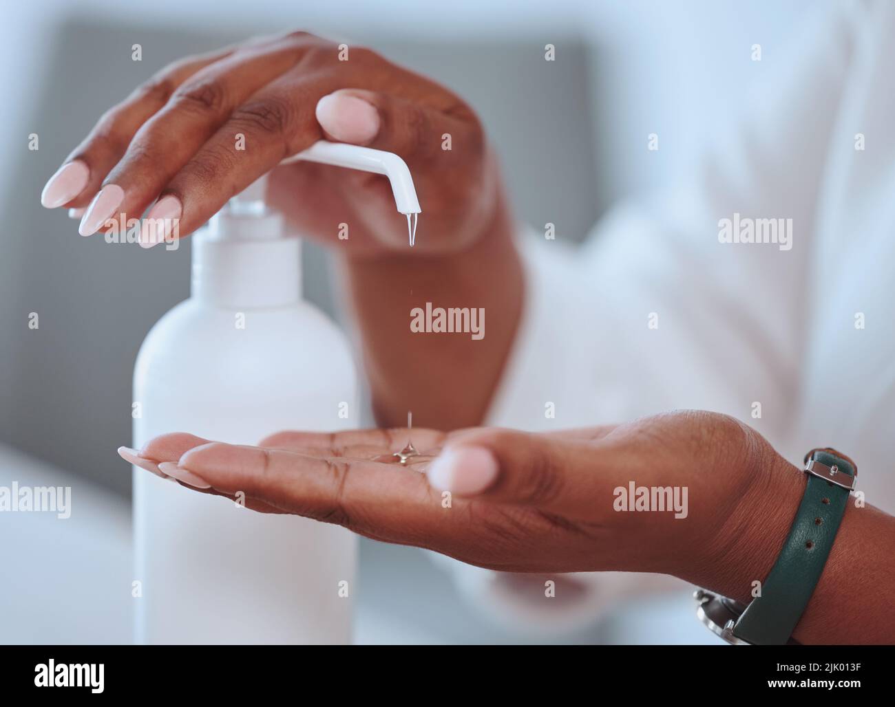 Closeup of beautiful female hands washing using hand sanitizer with ...