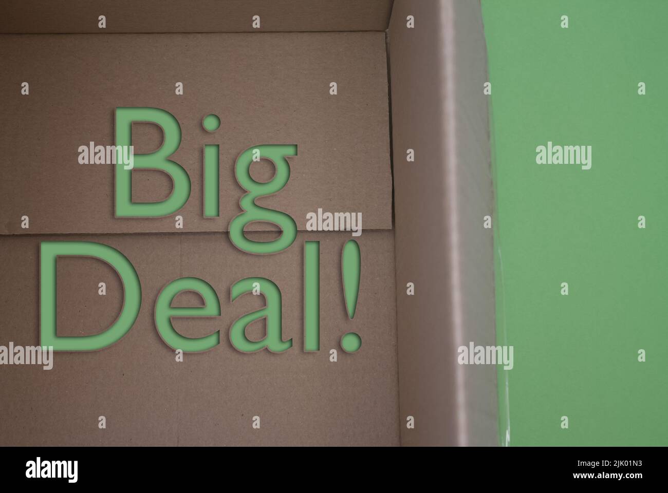 Big Deal word with cardboard box. Brown folded cardbox Stock Photo - Alamy