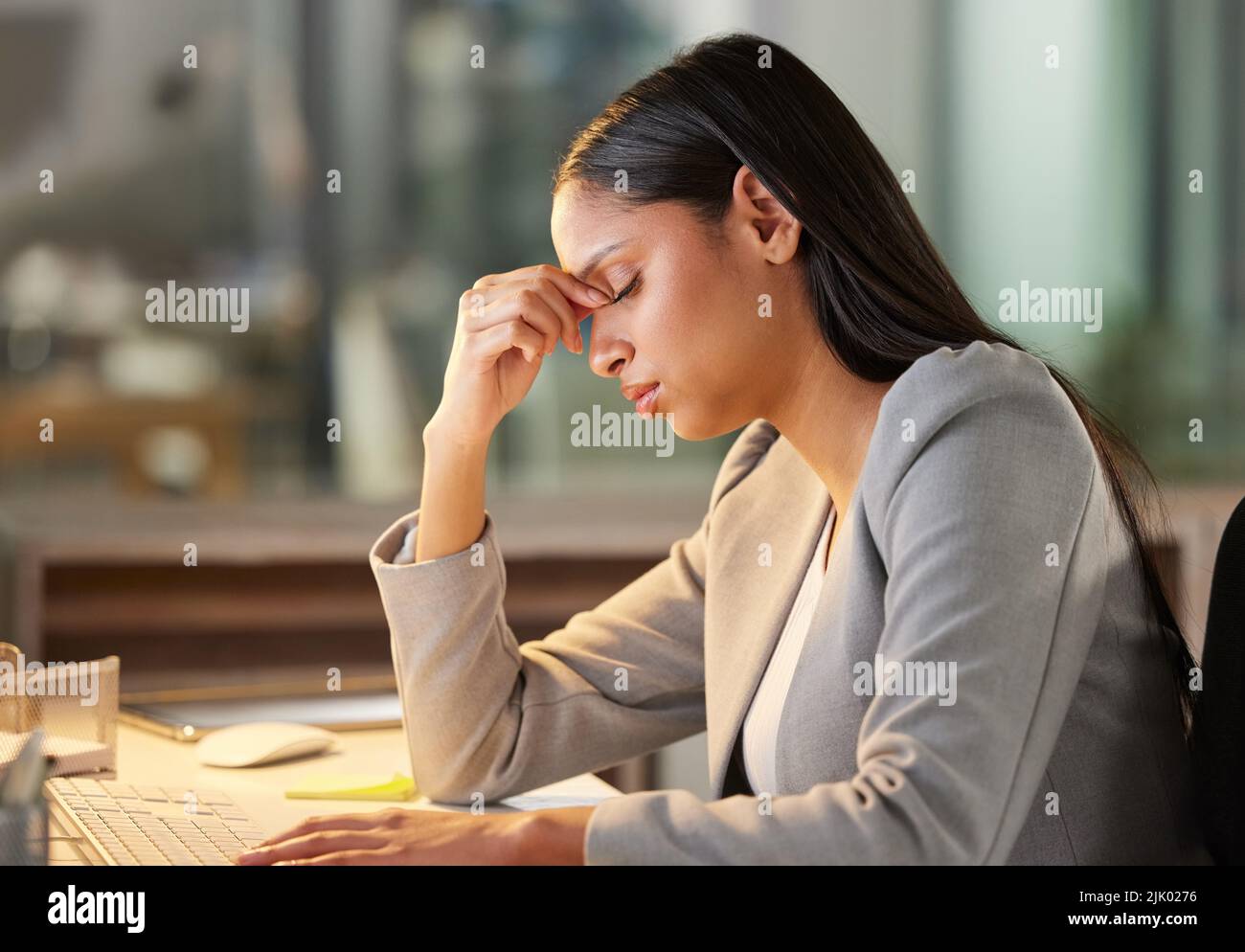My brain is fried. a young businesswoman looking stressed while using a ...