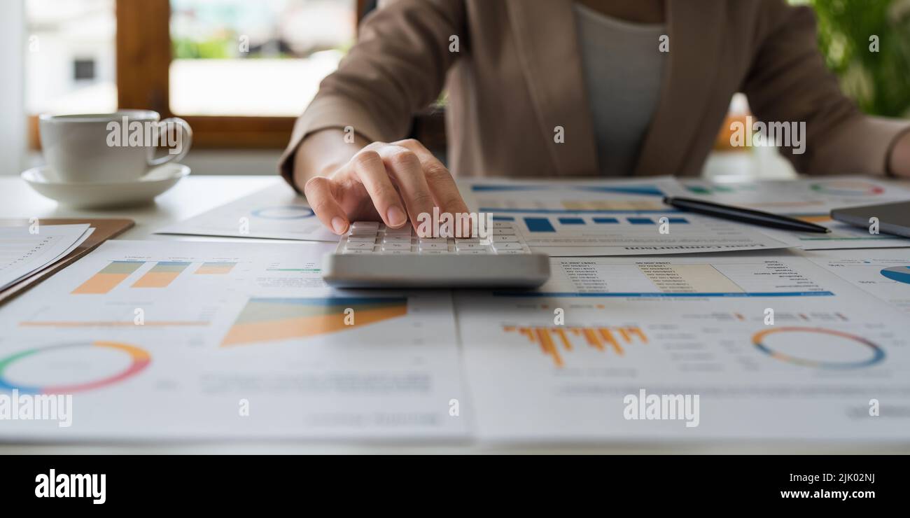 Business woman audit the company's financial results and budget ...