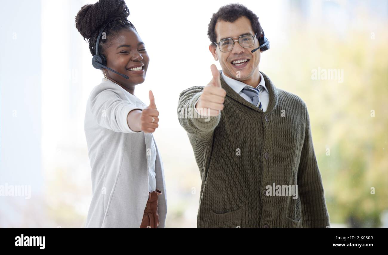 We guarantee the best in customer care. Portrait of two call centre ...