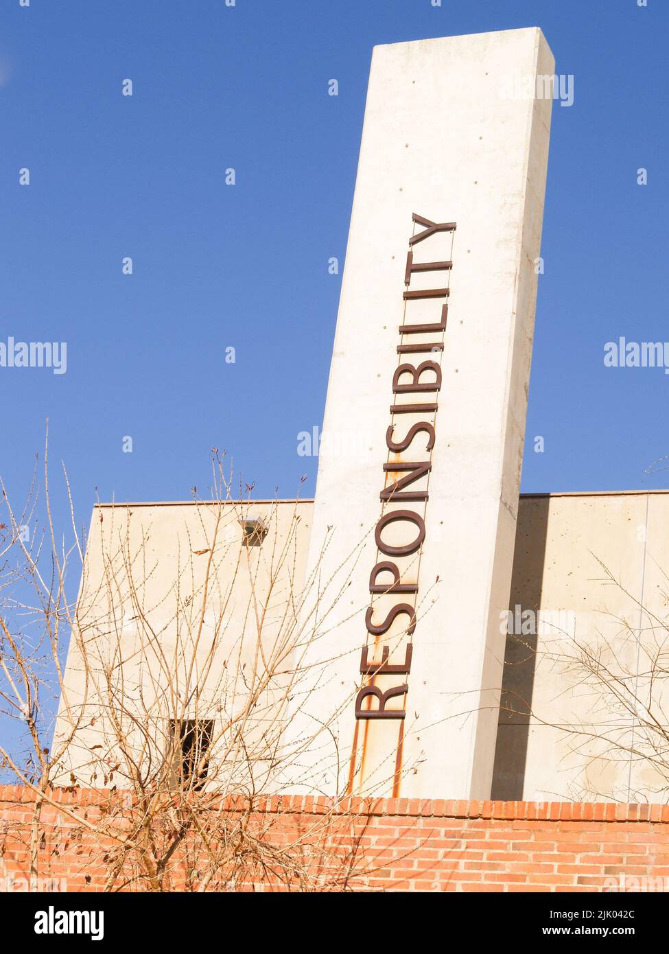 Word responsibility text vertically aligned on sign against blue sky ...