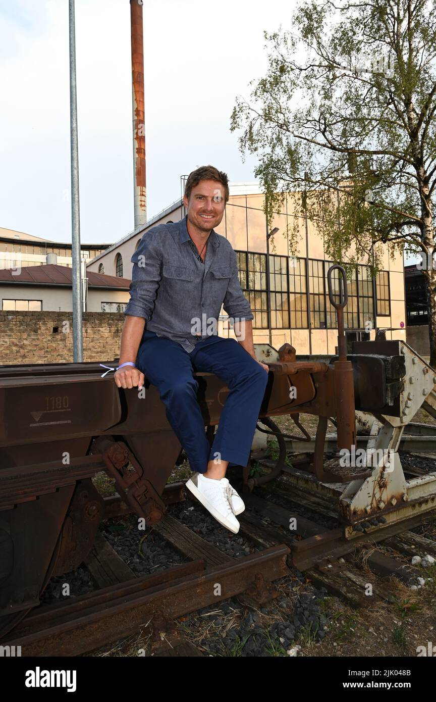 Munich, Germany. 28th July, 2022. Actor Leo Reisinger smiles before the ...