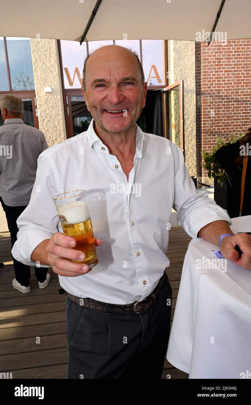 Munich, Germany. 28th July, 2022. Innkeeper Sepp Krätz smiles before ...