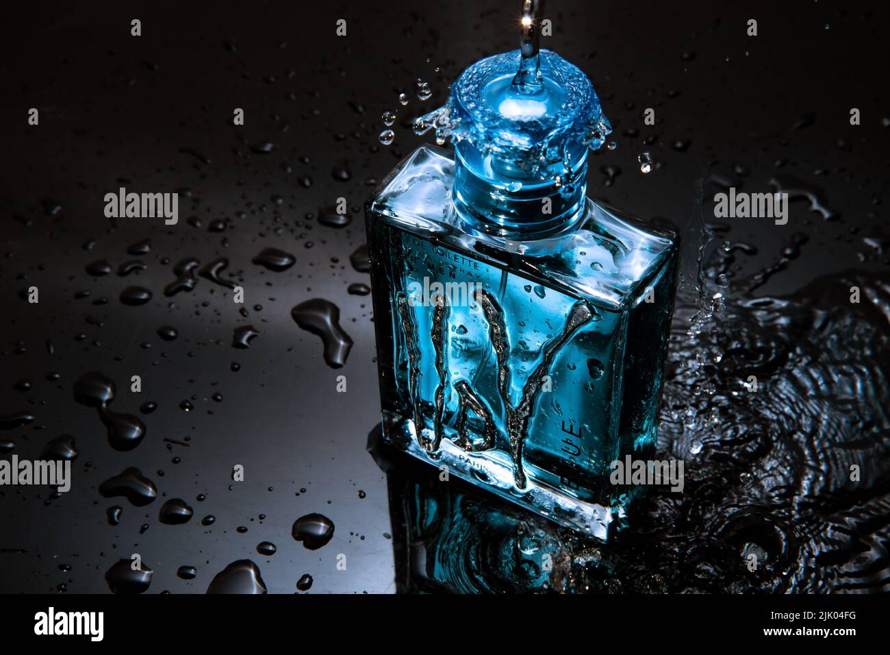 capturing this beautiful perfume bottle with water splash Stock Photo ...