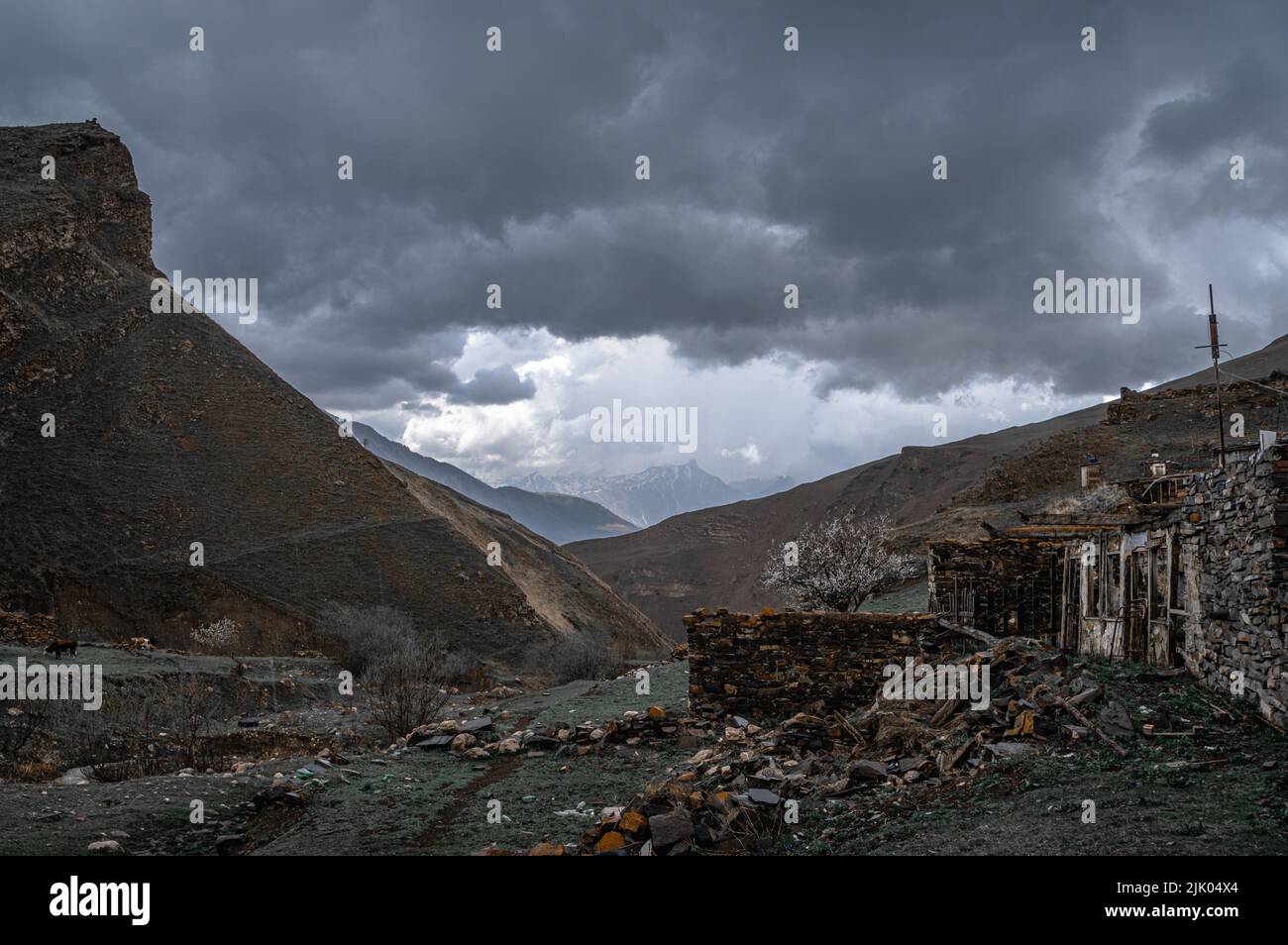 Picturesque view of a desolate village before the storm. Digoria, North ...