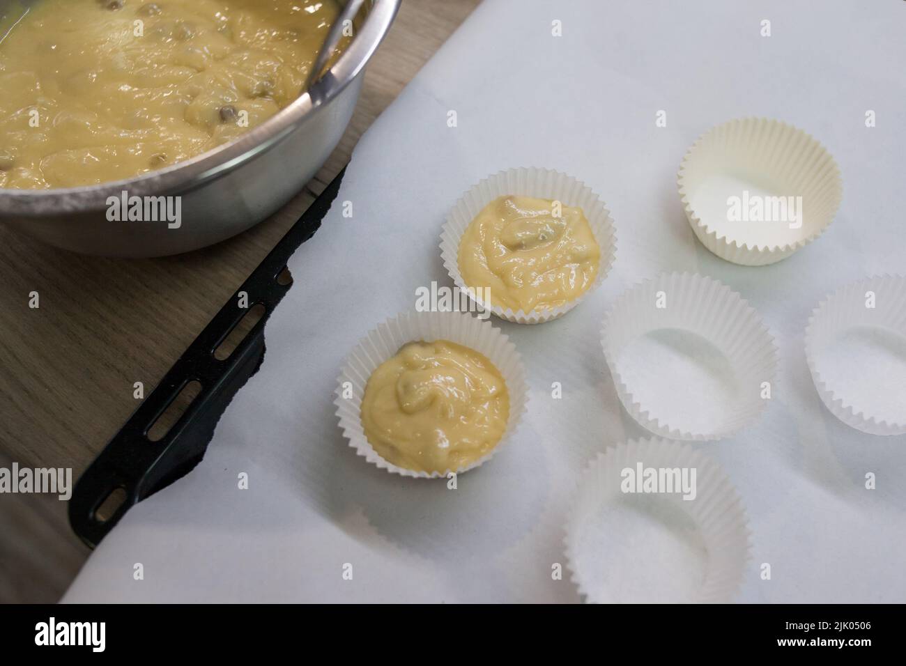 Filling paper molds dough muffins hi-res stock photography and images ...