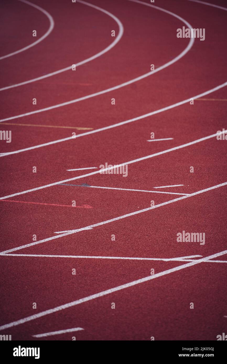 A red running track with lines Stock Photo - Alamy