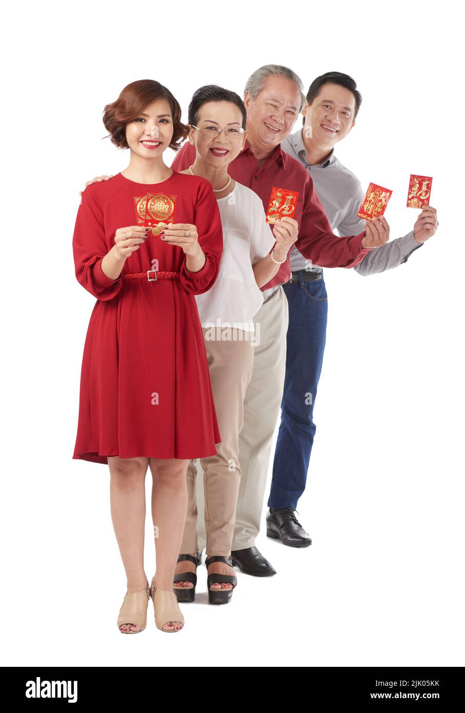 Cheerful family members holding lucky money envelopes with calligraphy ...