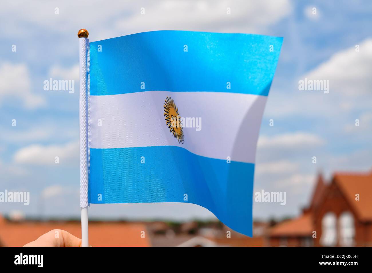 white and blue national flag with sun of Argentina close up Stock Photo ...