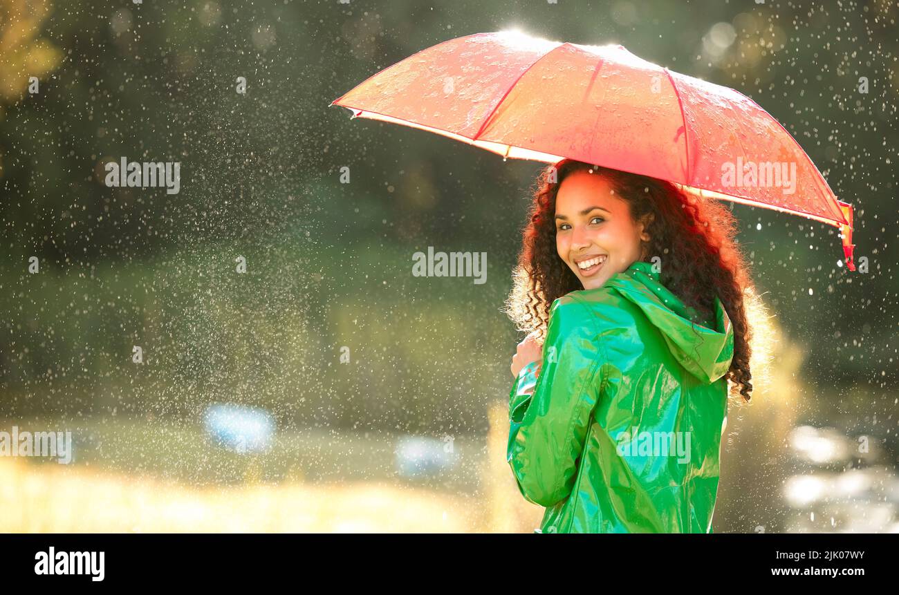The rain is calling and I must go. a beautiful young woman spending a day outside in the rain ...