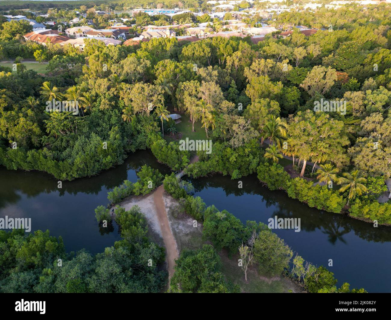 Aerial shot of path and bridge on river at sunset in Cairns Queensland ...