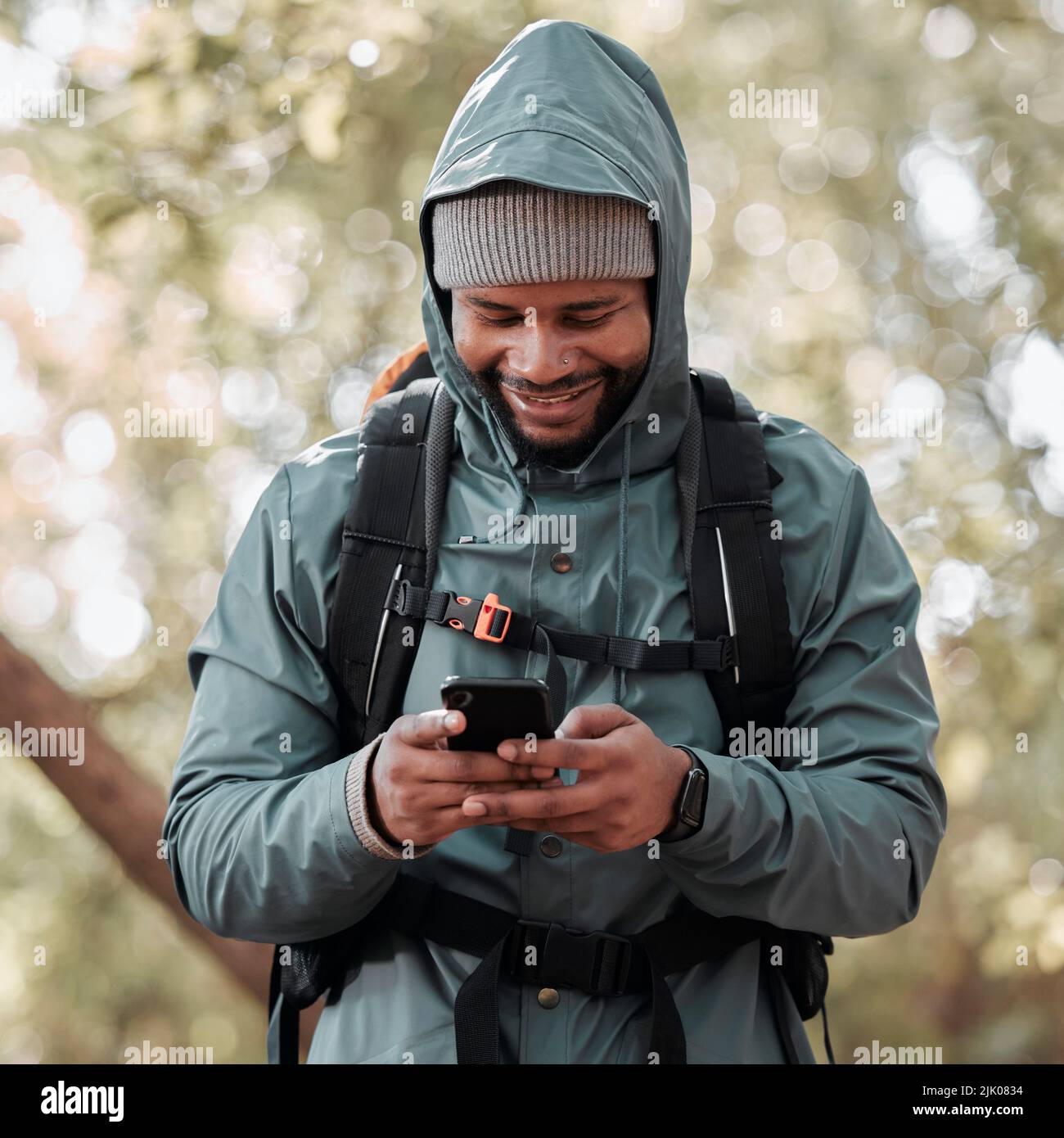 Im getting some friends to join me on my hike. a man using his ...