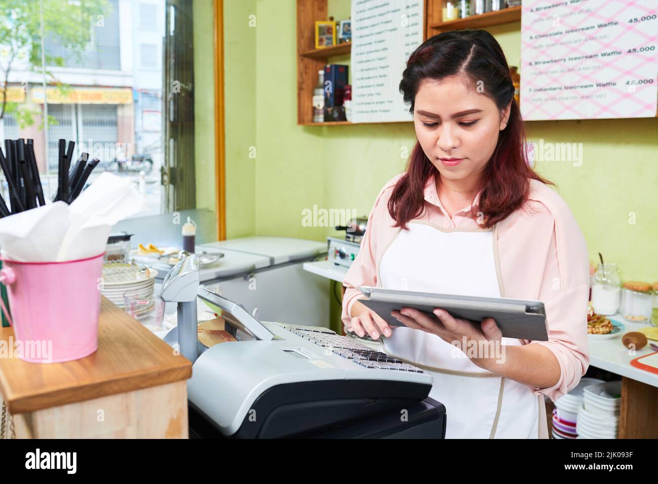 Asian female reading grocery hi-res stock photography and images - Alamy