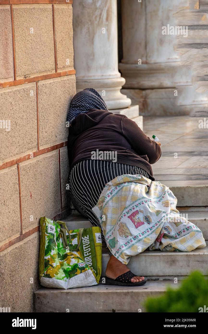 old woman begging on the streets of chania on the greek island of crete ...