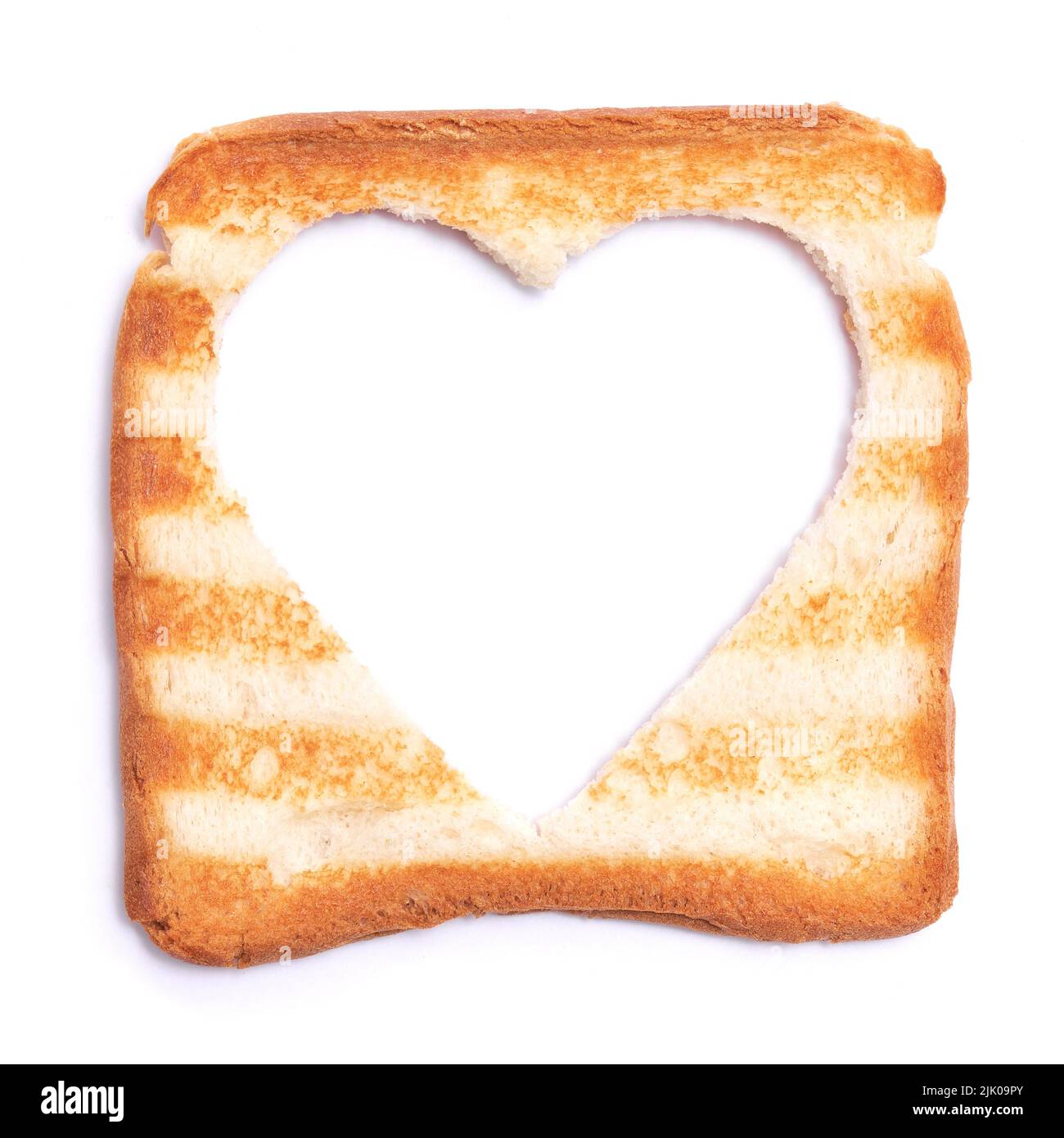 Toasted bread with grill marks and heart shaped hole isolated on white ...