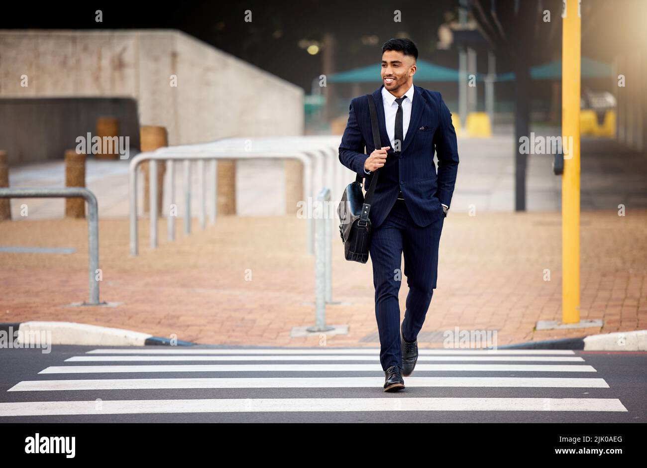 On my way to crush the competition. a young businessman walking around ...