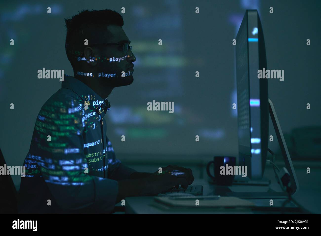 Projection of programming code on Indian software developer Stock Photo ...