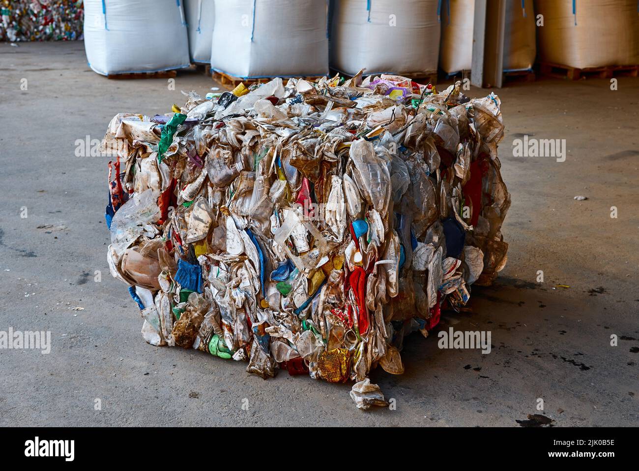 Block of pressed plastic bags at waste recycling plant Stock Photo - Alamy