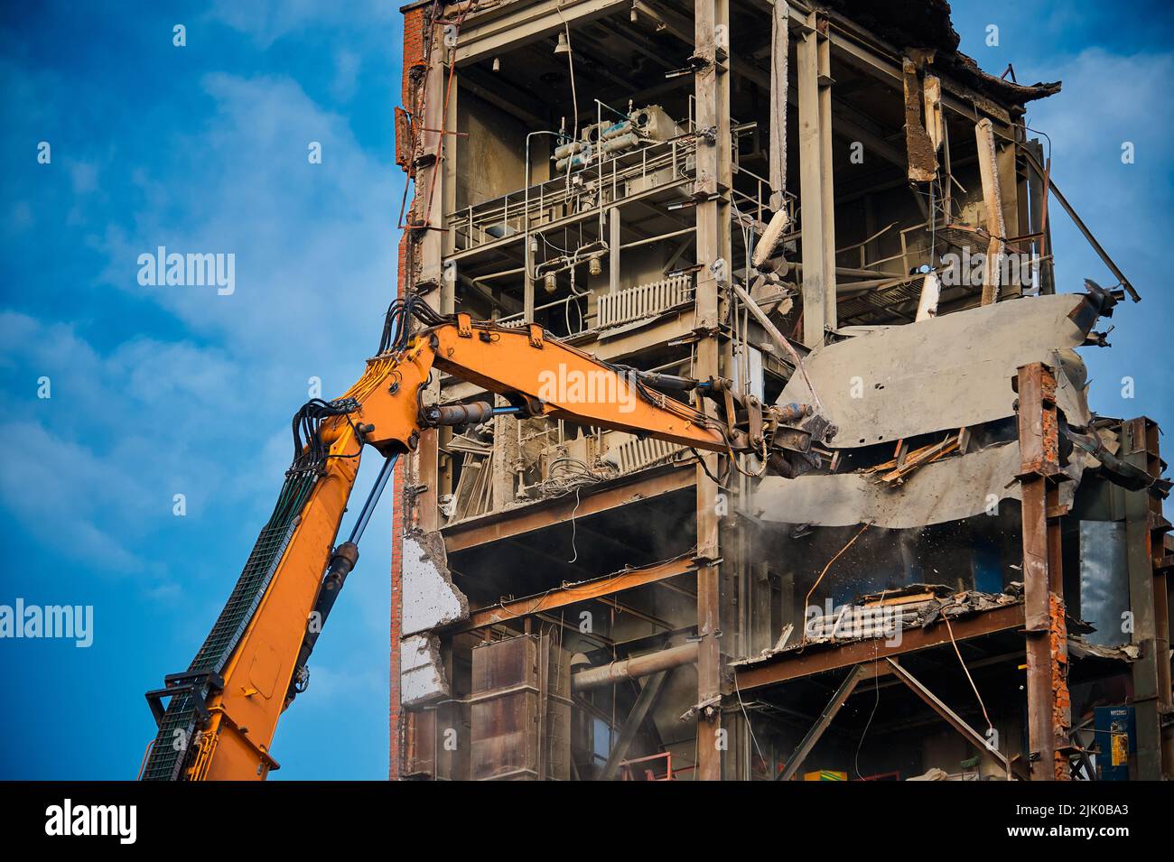 Destroying of old industrial building by excavator destroyer Stock ...
