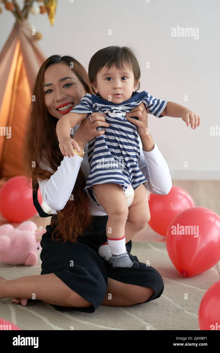 Vietnamese young woman with her cute little son Stock Photo - Alamy