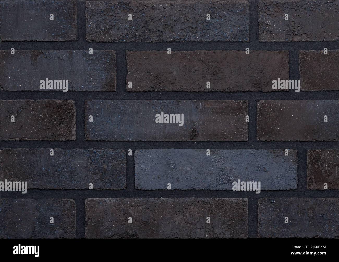 Grey brick wall texture with different colours spots Stock Photo - Alamy