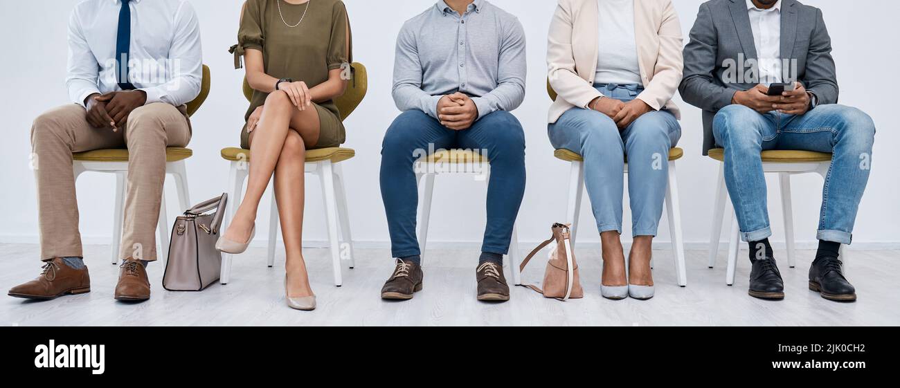 Waiting their turn at a new opportunity. Studio shot of a group of ...