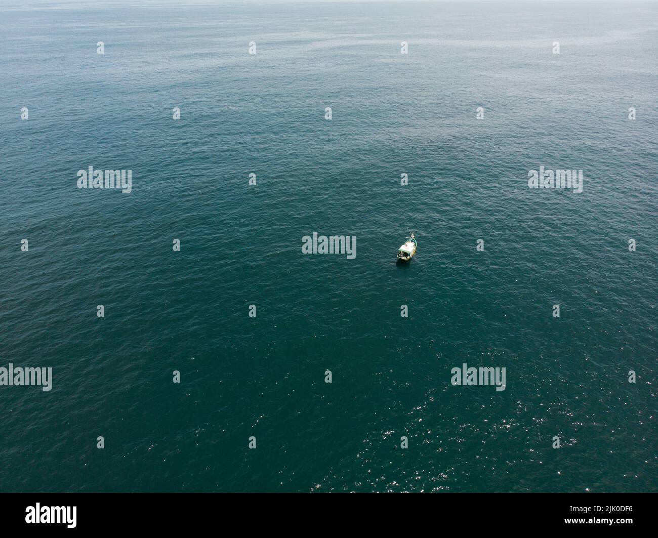 An aerial view of small ship in the open sea Stock Photo - Alamy